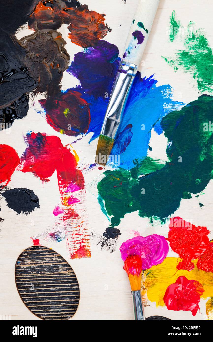 mixed together multi colored paints for creativity and drawing, oil and ...