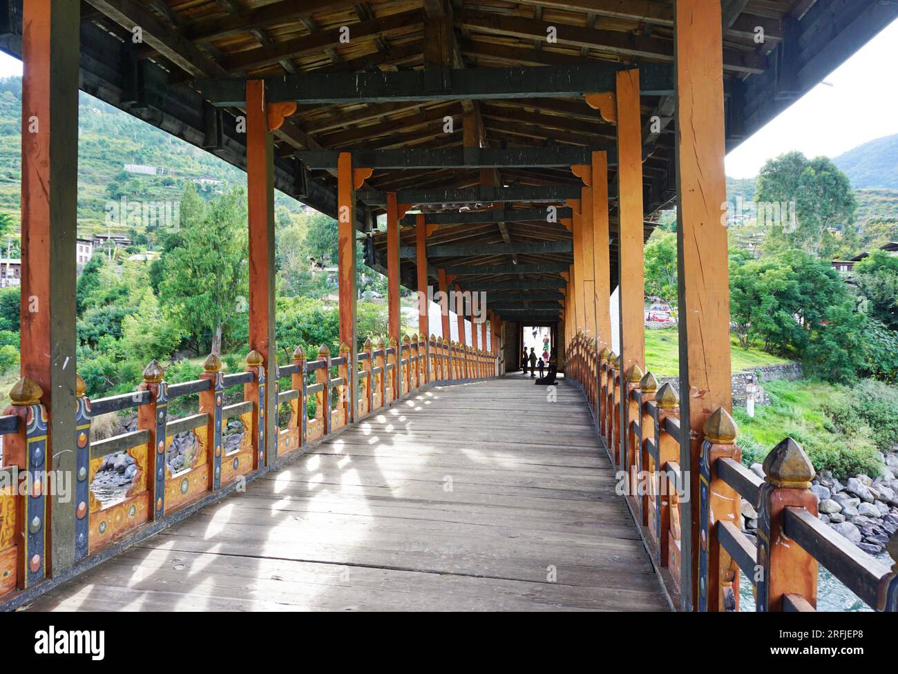 Looking across the historic covered wooden cantilever bridge leading ...