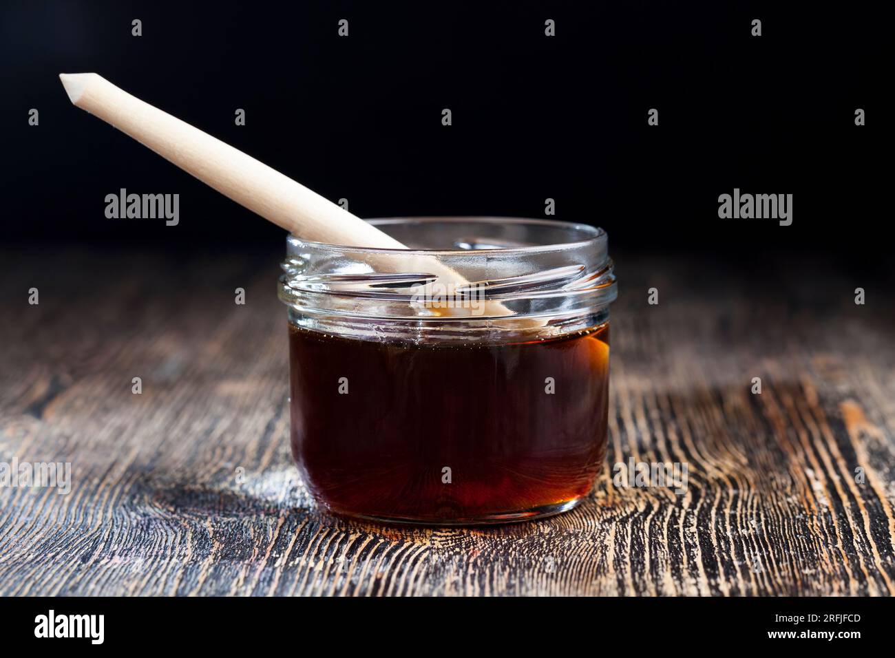 thick and sweet buckwheat honey of dark red color from buckwheat ...