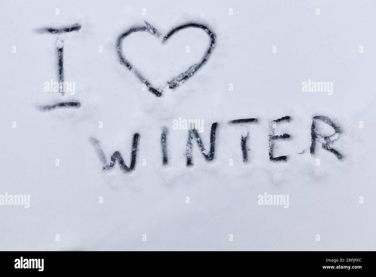 snow with drawings of the words I love winter in the winter season ...