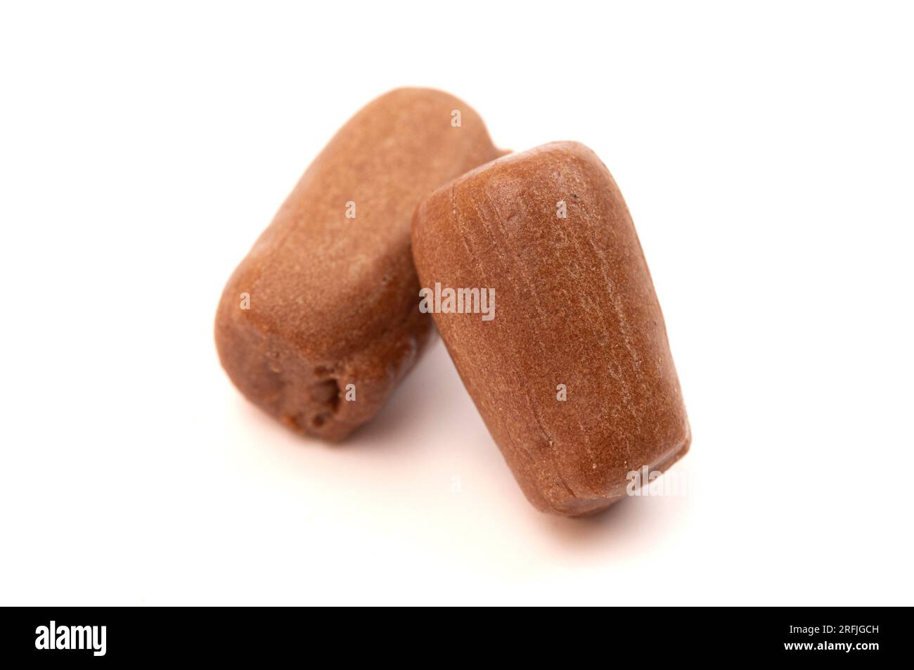 Freeze Dried Chocolate Candy Rolls on a White Background Stock Photo ...