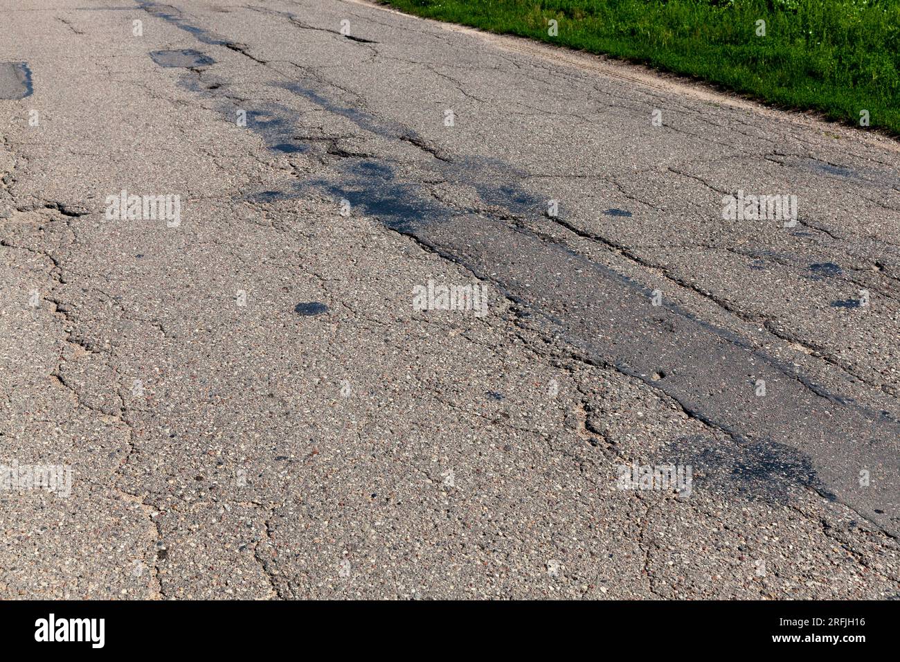 repair of a broken and damaged paved road, the road has many defects ...