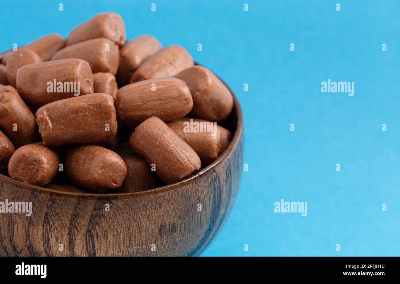 Pile of Freeze Dried Chocolate Candy Rolls Isolated on a Blue ...