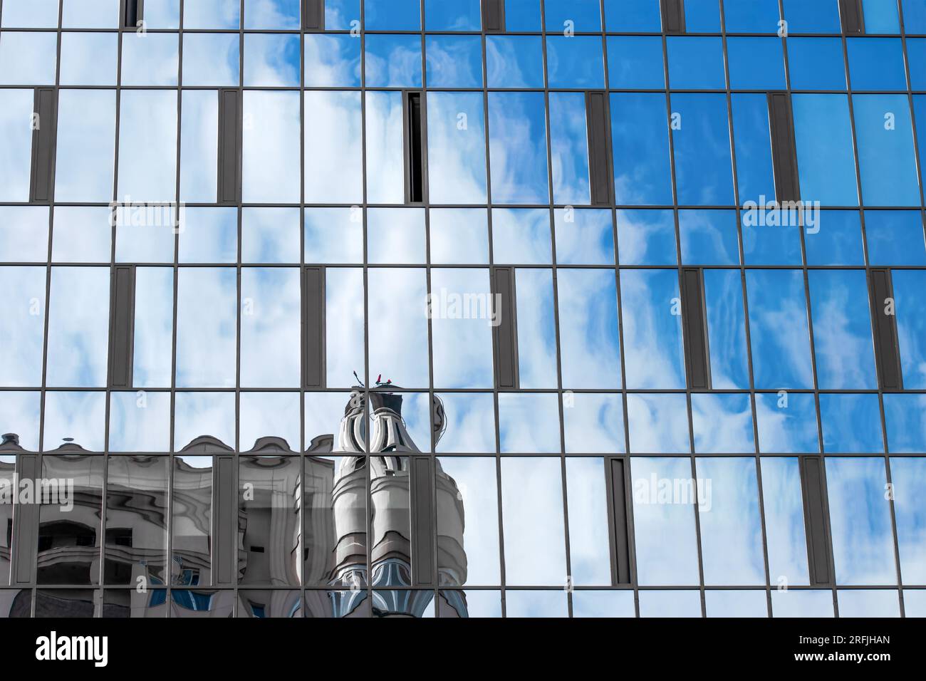 A modern office building with glass windows Stock Photo - Alamy