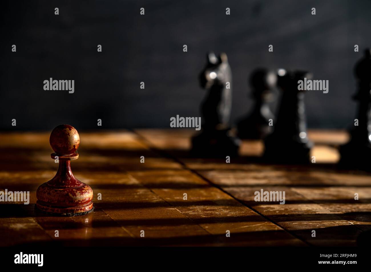 one pawn against army of black pieces. threat, danger and resistance ...