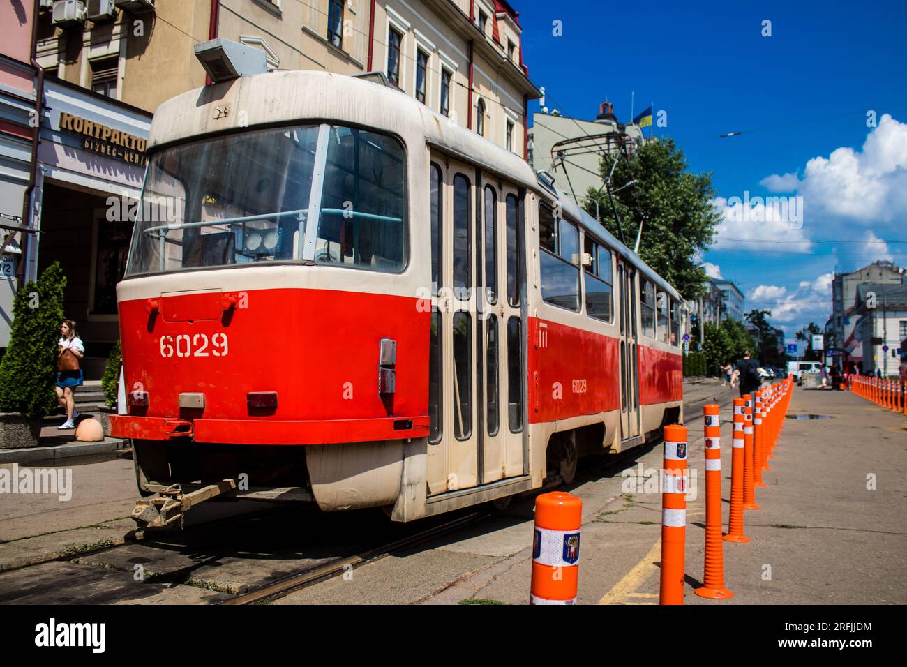 Kyiv, Ukraine - August 01, 2023 Tram rolling in downtown Kyiv. People ...