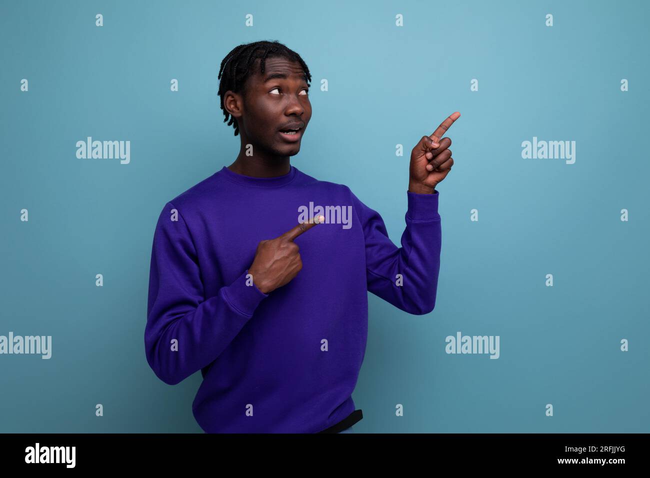 smart american young adult with dreadlocks pointing to the side Stock ...