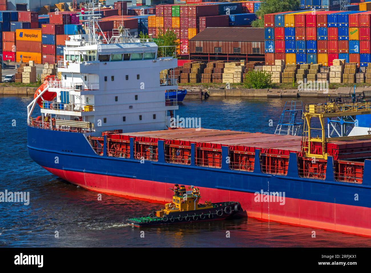 Cargo ship & tugboat, Daugava River, Riga, Latvia, Europe Stock Photo ...