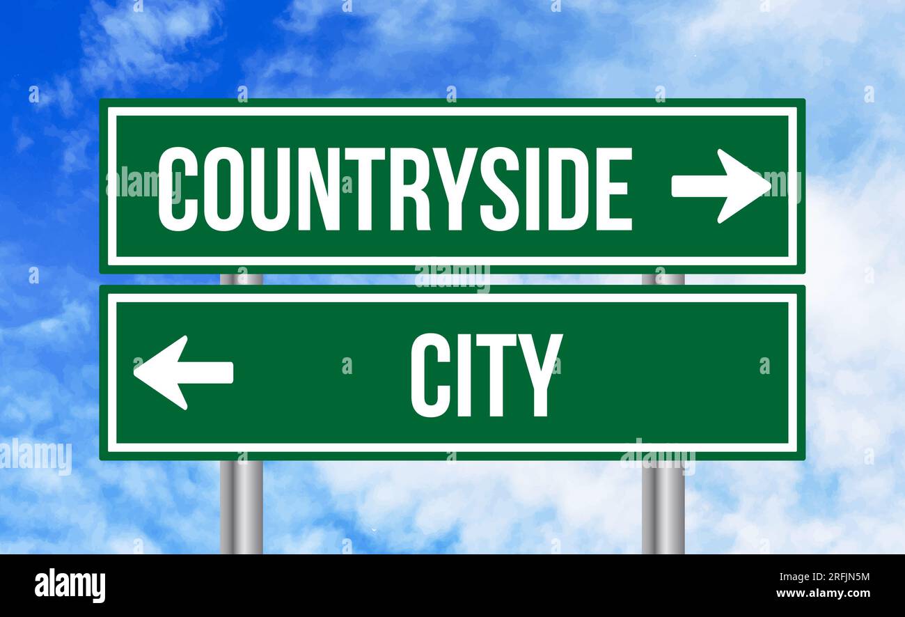 Countryside or city road sign on blue sky background Stock Photo - Alamy
