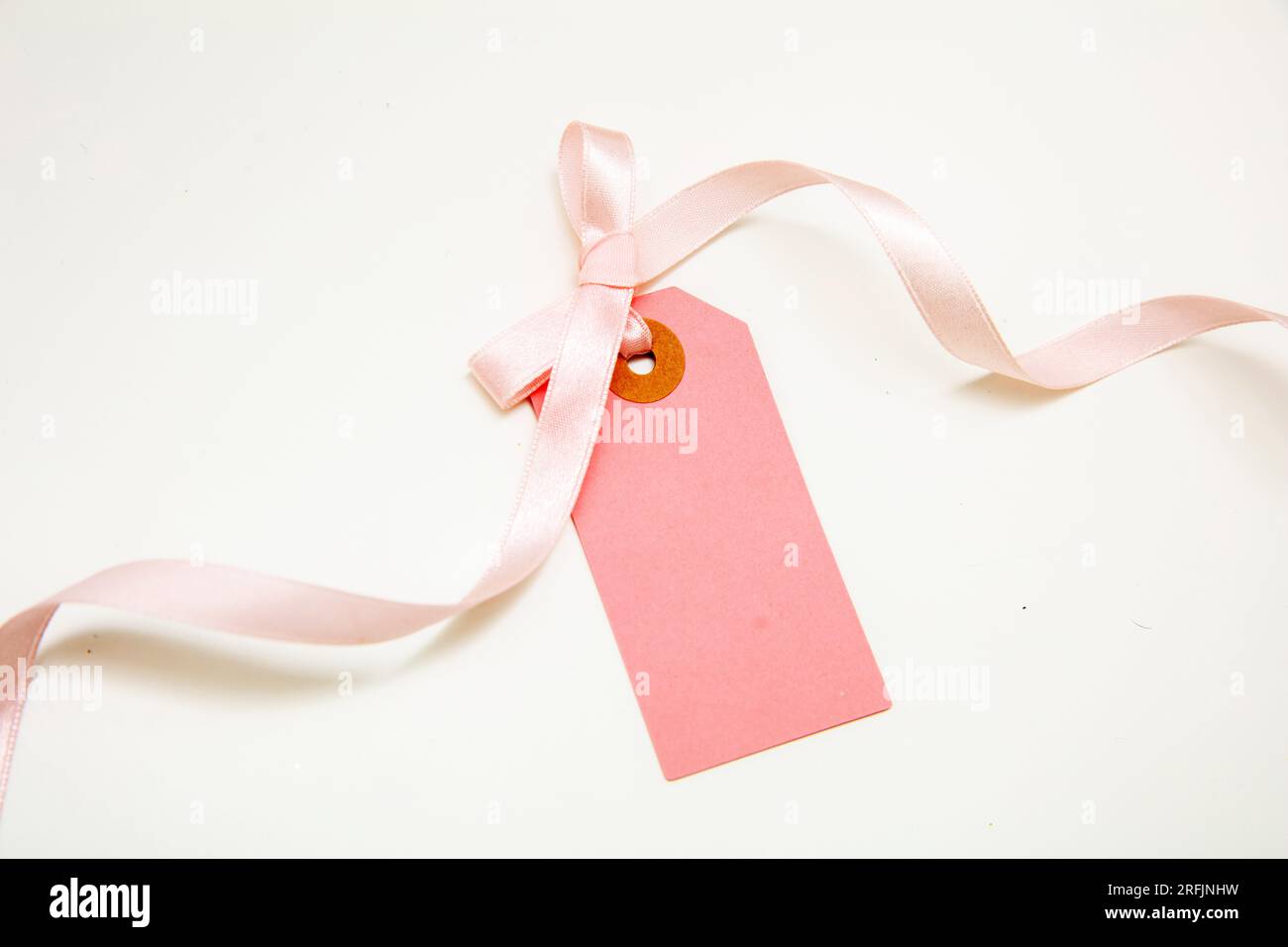 Blank pink price tag isolated on white background. Pastel color empty ...