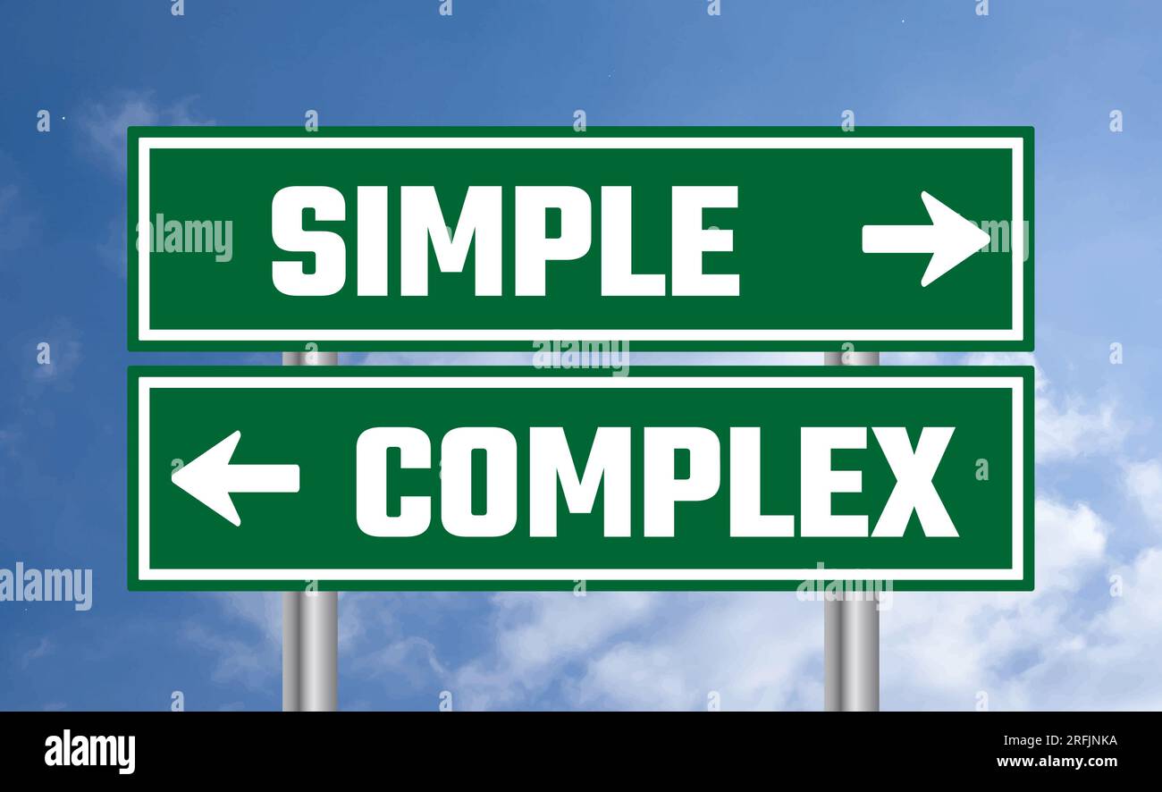 Simple or complex road sign on blue sky background Stock Photo - Alamy