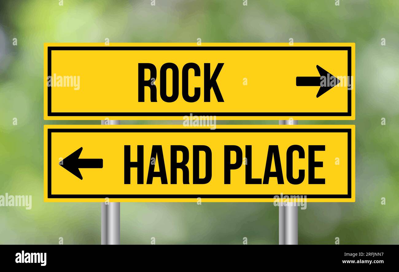 Rock or hard place road sign on blur background Stock Photo - Alamy