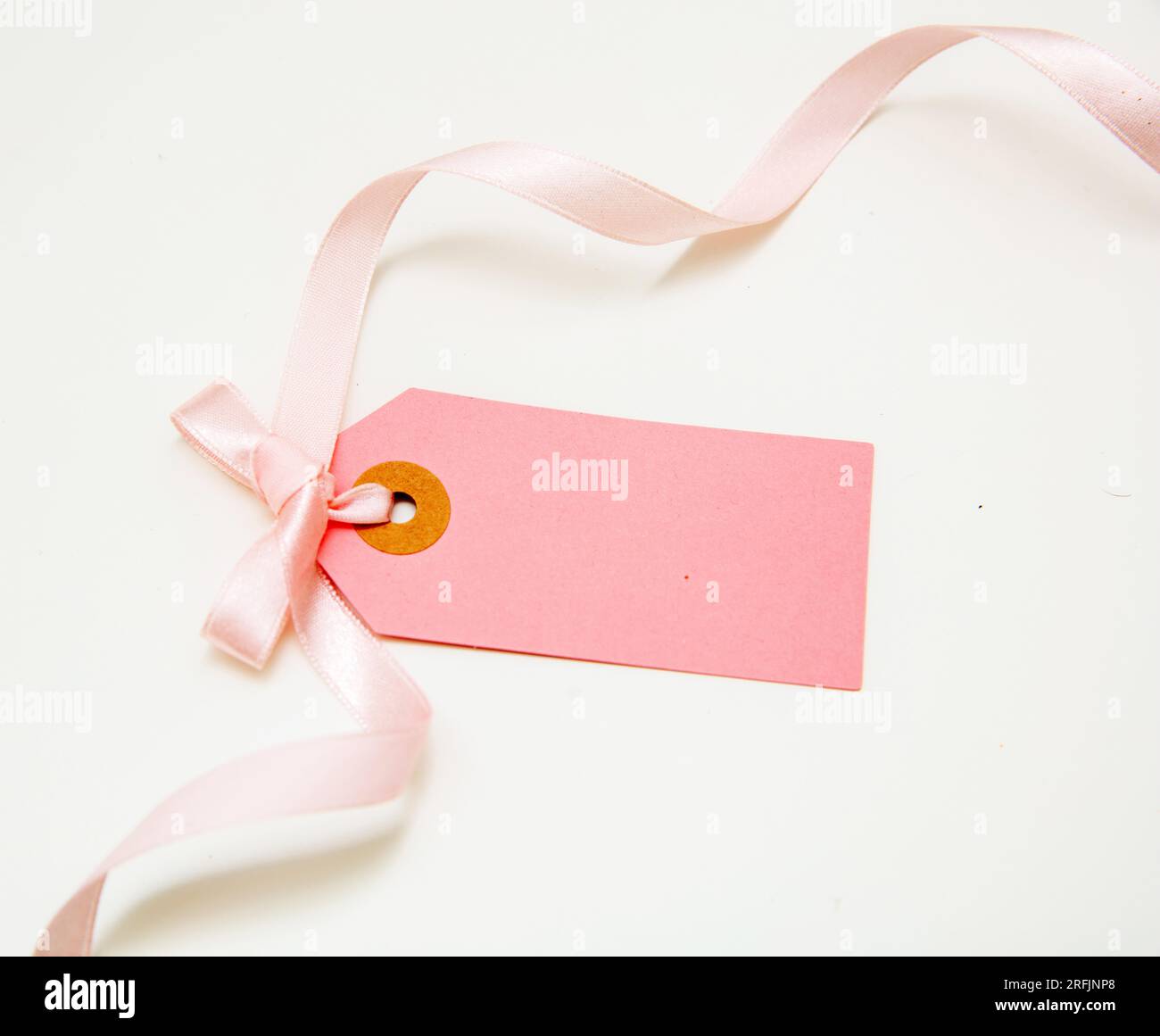 Blank pink price tag isolated on white background. Pastel color empty ...