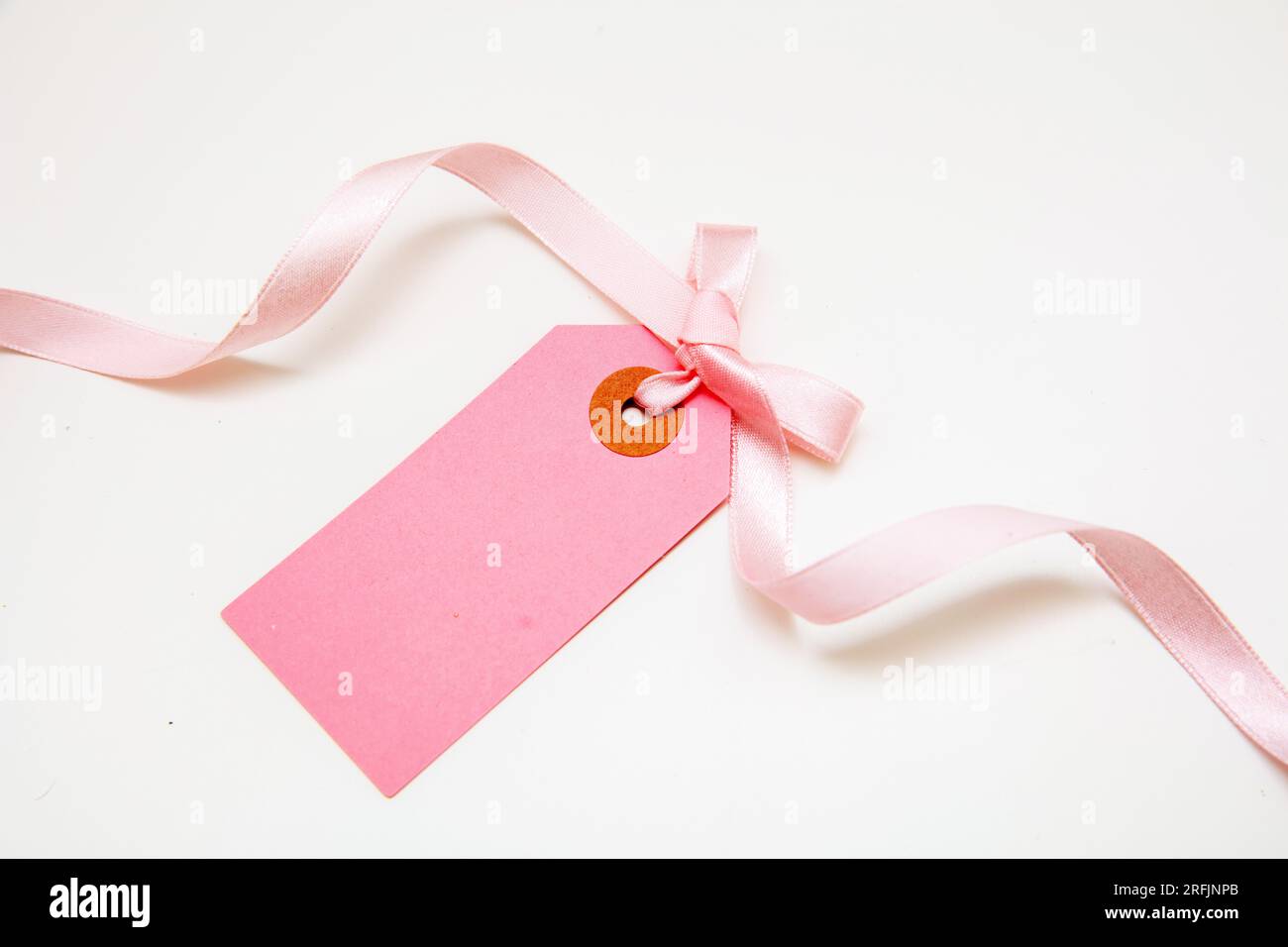 Blank pink price tag isolated on white background. Pastel color empty ...