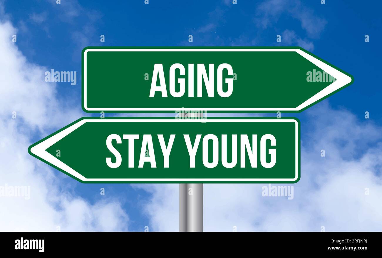 Aging or stay young road sign on blue sky background Stock Photo - Alamy