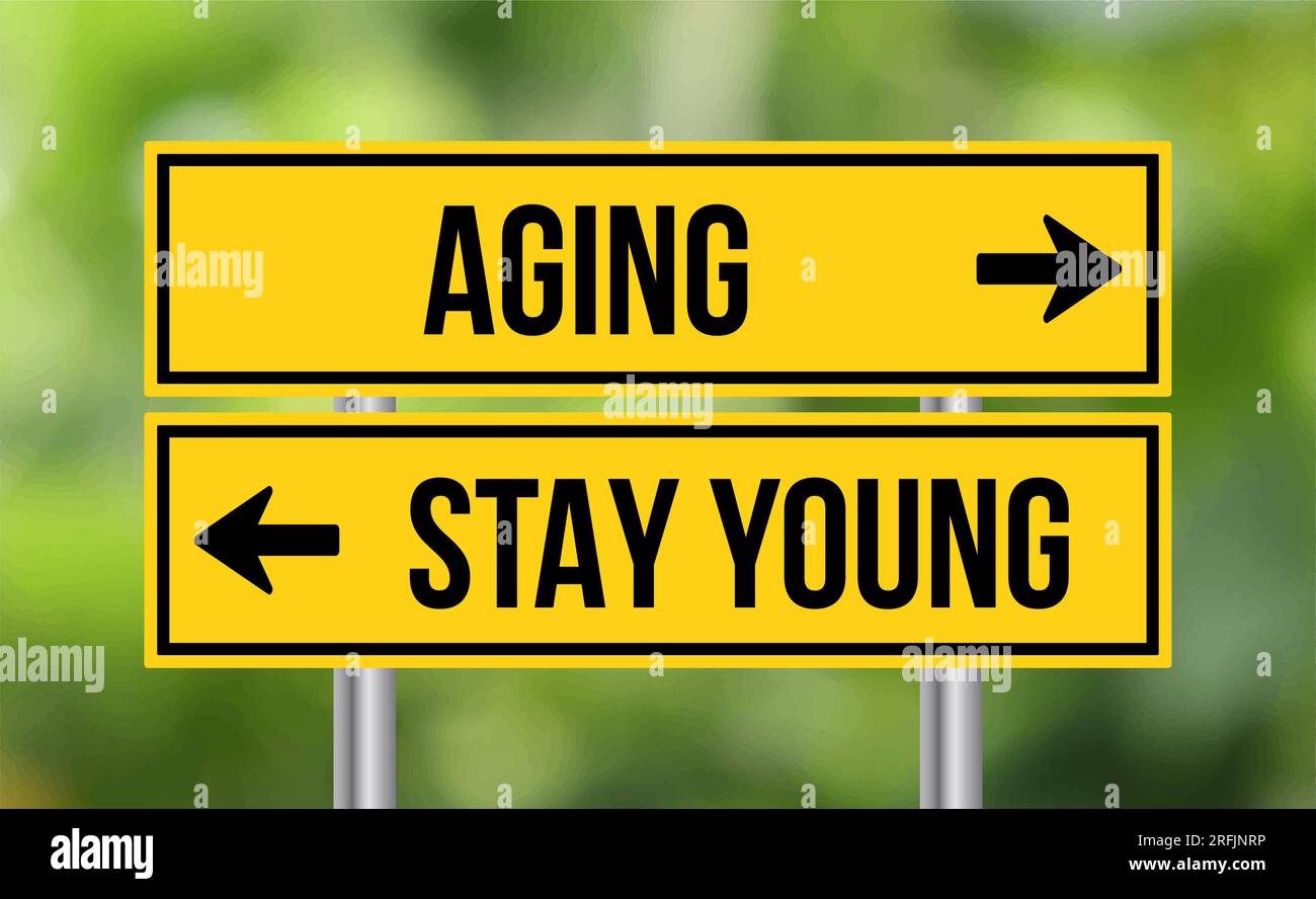 Aging or stay young road sign on blur background Stock Photo - Alamy