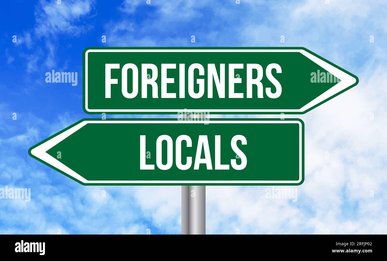 Foreigners or locals road sign on cloudy sky background Stock Photo - Alamy