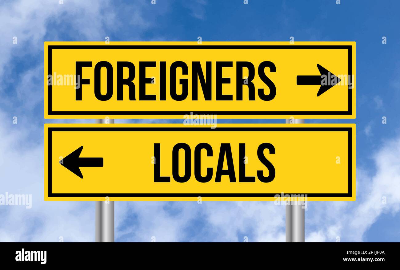 Foreigners or locals road sign on cloudy sky background Stock Photo - Alamy