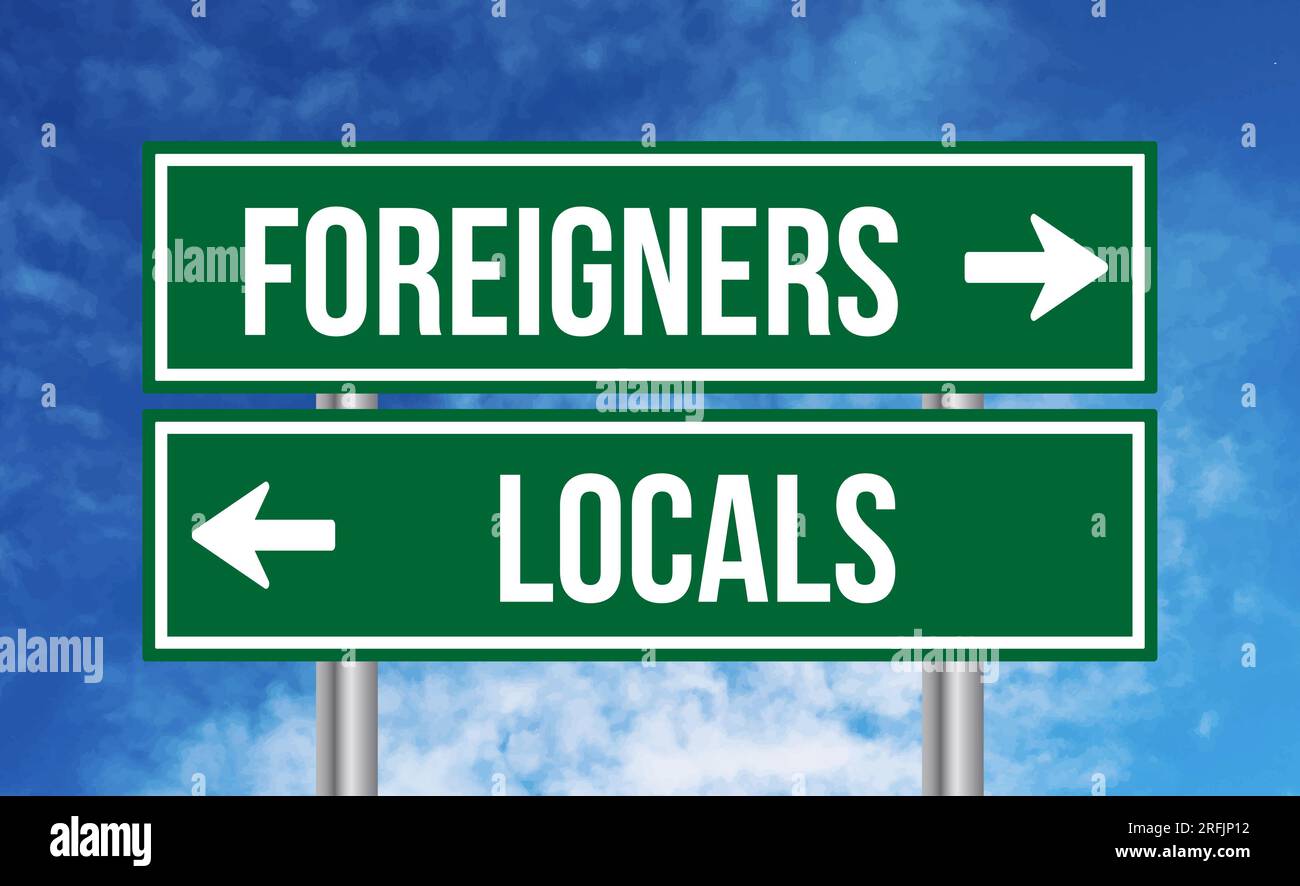 Foreigners or locals road sign on cloudy sky background Stock Photo - Alamy