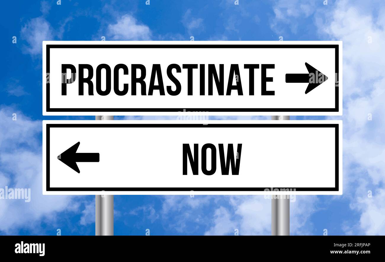 Procrastinate or now road sign on cloudy sky background Stock Photo - Alamy