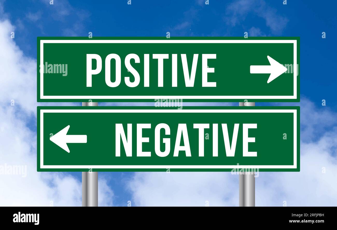 Positive or negative road sign on sky background Stock Photo - Alamy