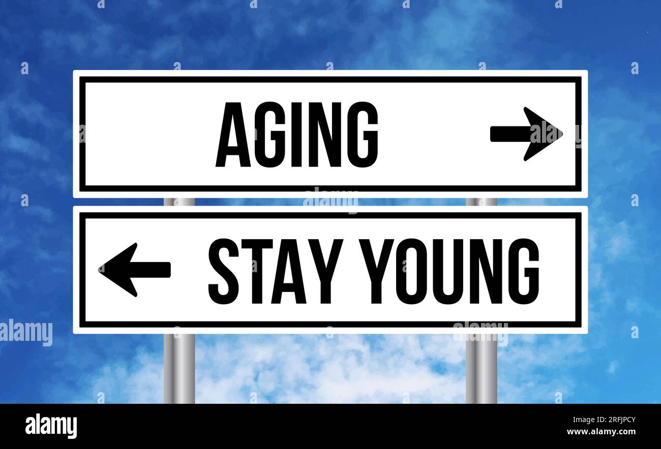 Aging or stay young road sign on blue sky background Stock Photo - Alamy