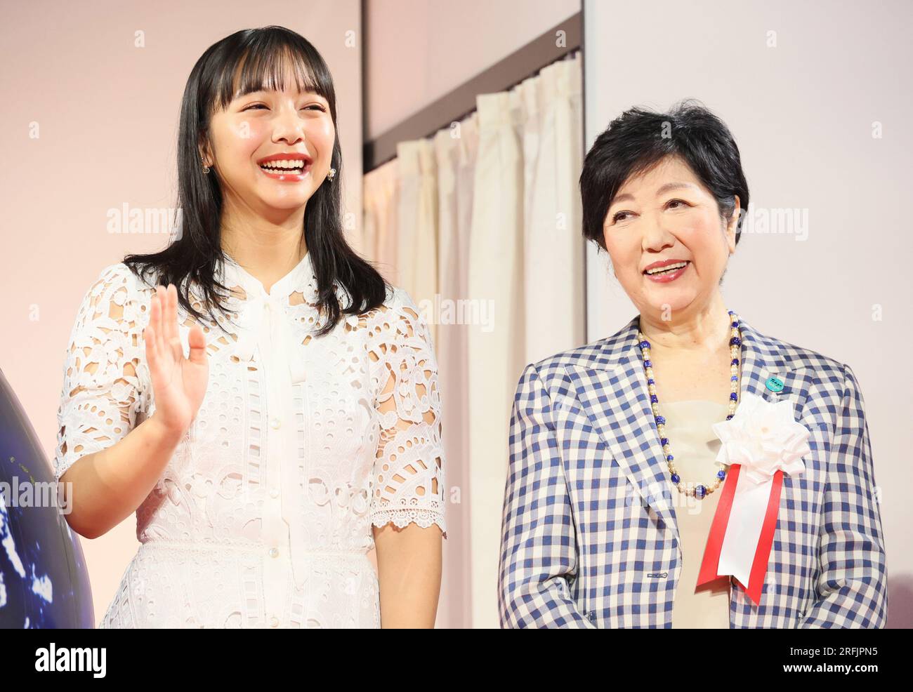 August 4, 2023, Tokyo, Japan - Japanese actress Suzu Yamanouchi (L) and Tokyo Governor Yuriko ...
