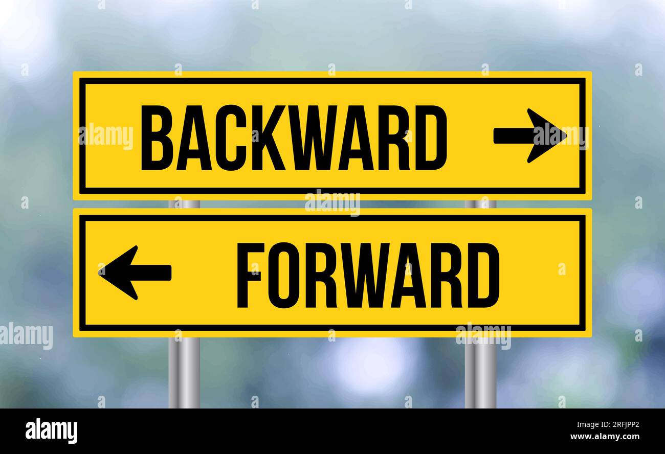 Backward or forward road sign on blur background Stock Photo - Alamy