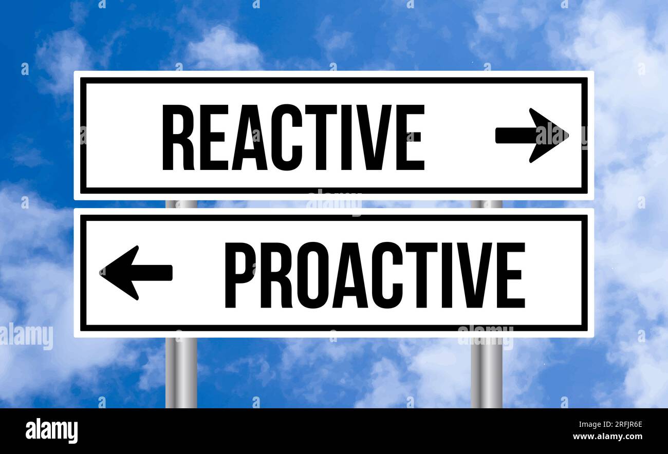 Reactive or proactive road sign on blue sky background Stock Photo - Alamy
