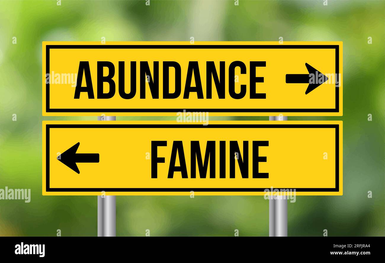 Abundance or famine road sign on blur background Stock Photo - Alamy