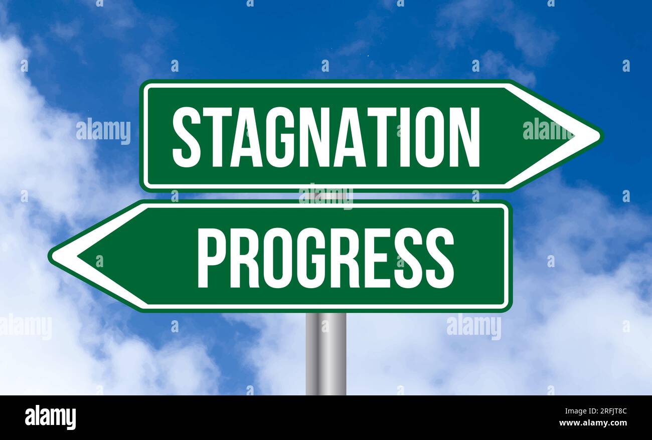 Stagnation or progress road sign on blue sky background Stock Photo - Alamy