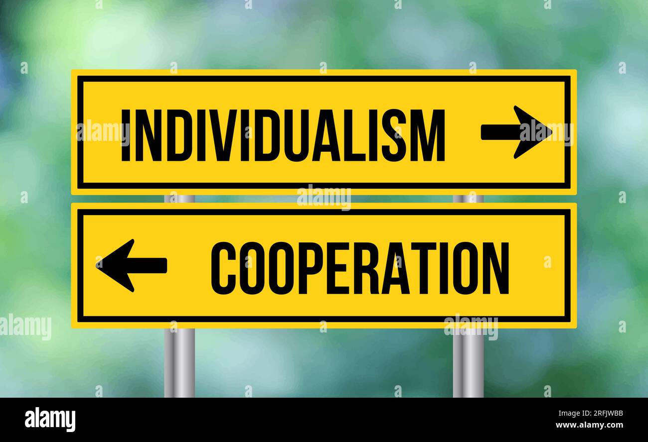 Individualism or cooperation road sign on blur background Stock Photo ...