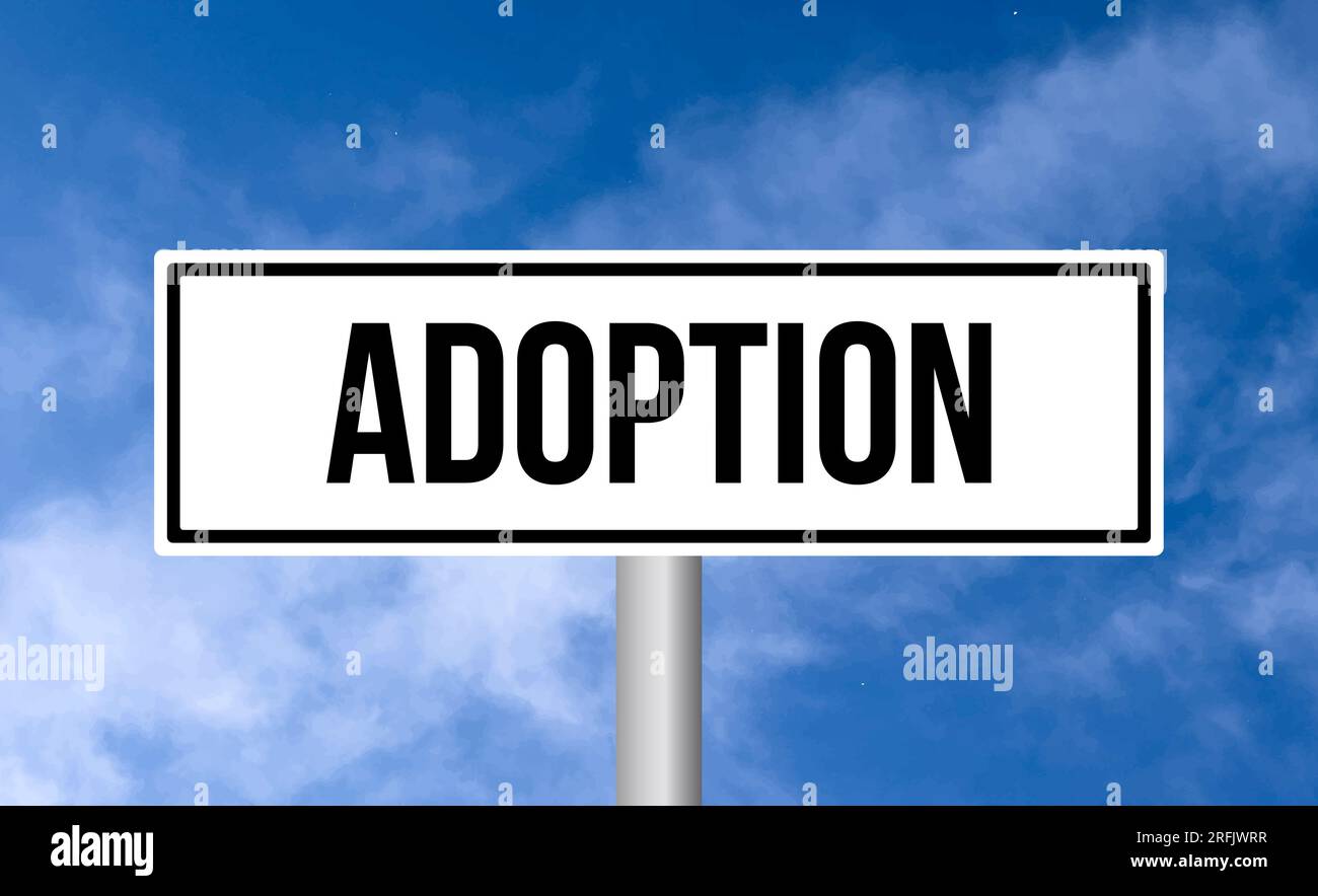 Adoption road sign on cloudy sky background Stock Photo - Alamy