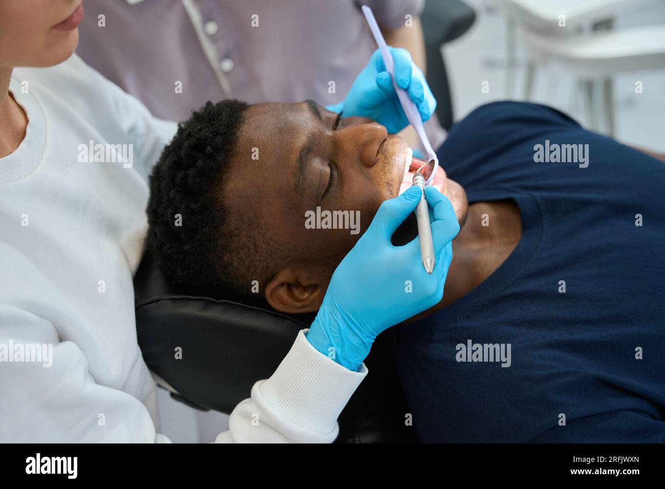 Woman stomatologist holding in hands special tools to check health of ...