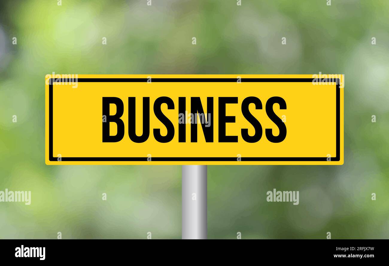 Business road sign on blur background Stock Photo - Alamy