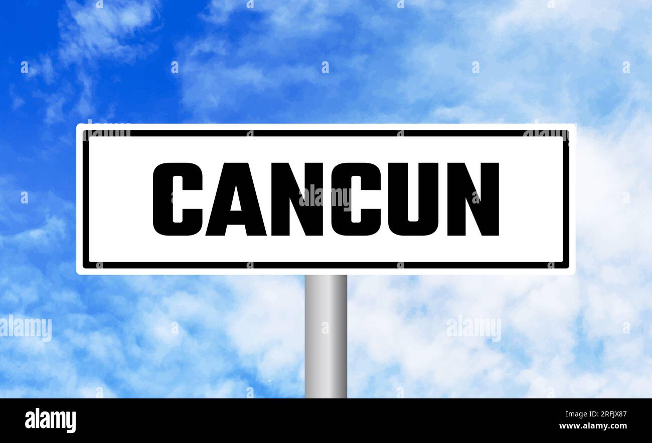 Cancun road sign on cloudy sky background Stock Photo - Alamy