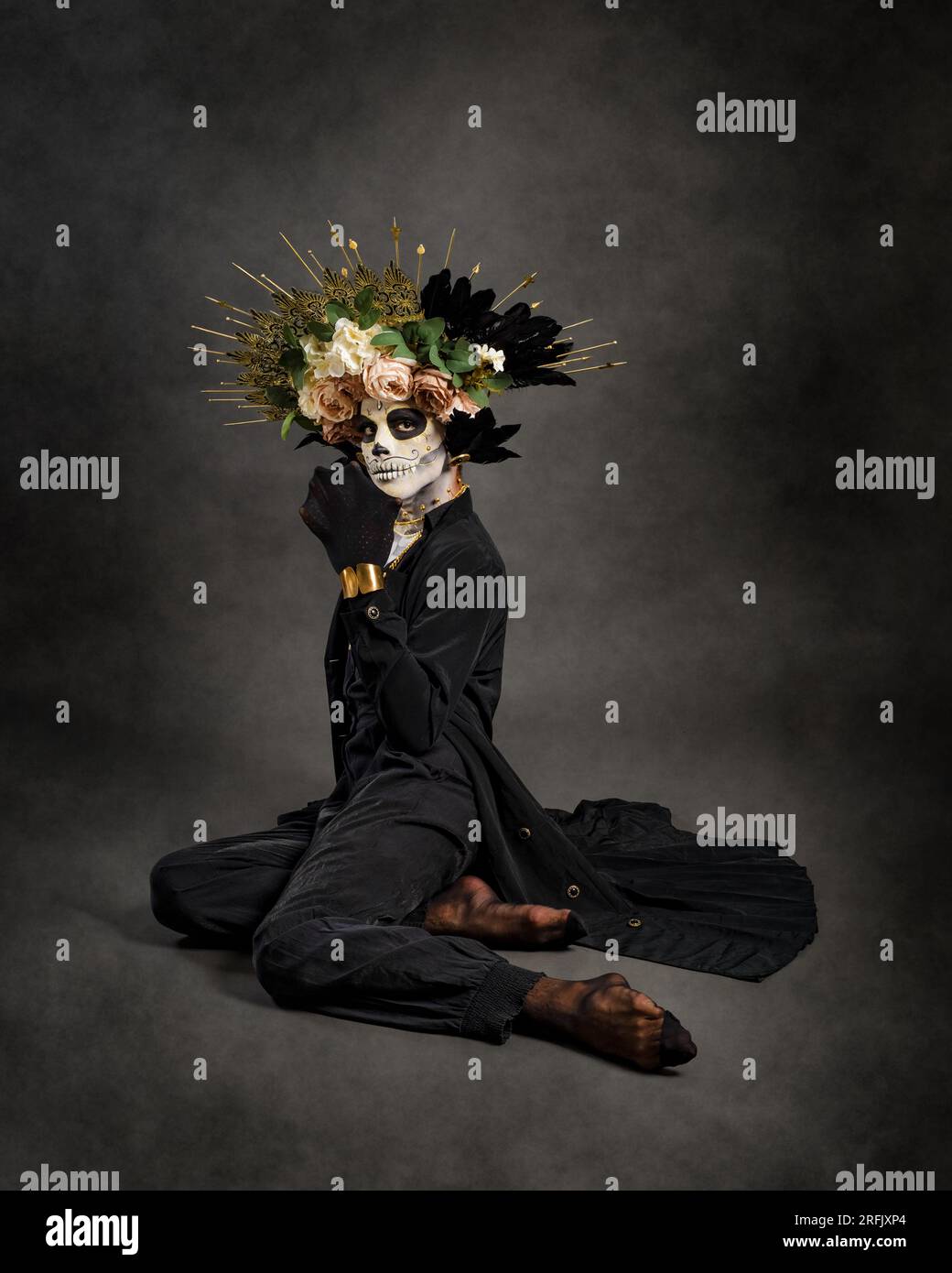 Studio portrait of Drag Queen catrin. Catrin dressed in black with ...