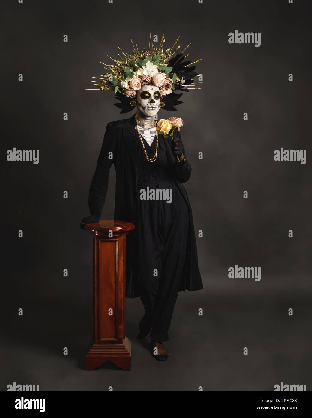 Studio portrait of Drag Queen catrin. Catrin dressed in black with ...