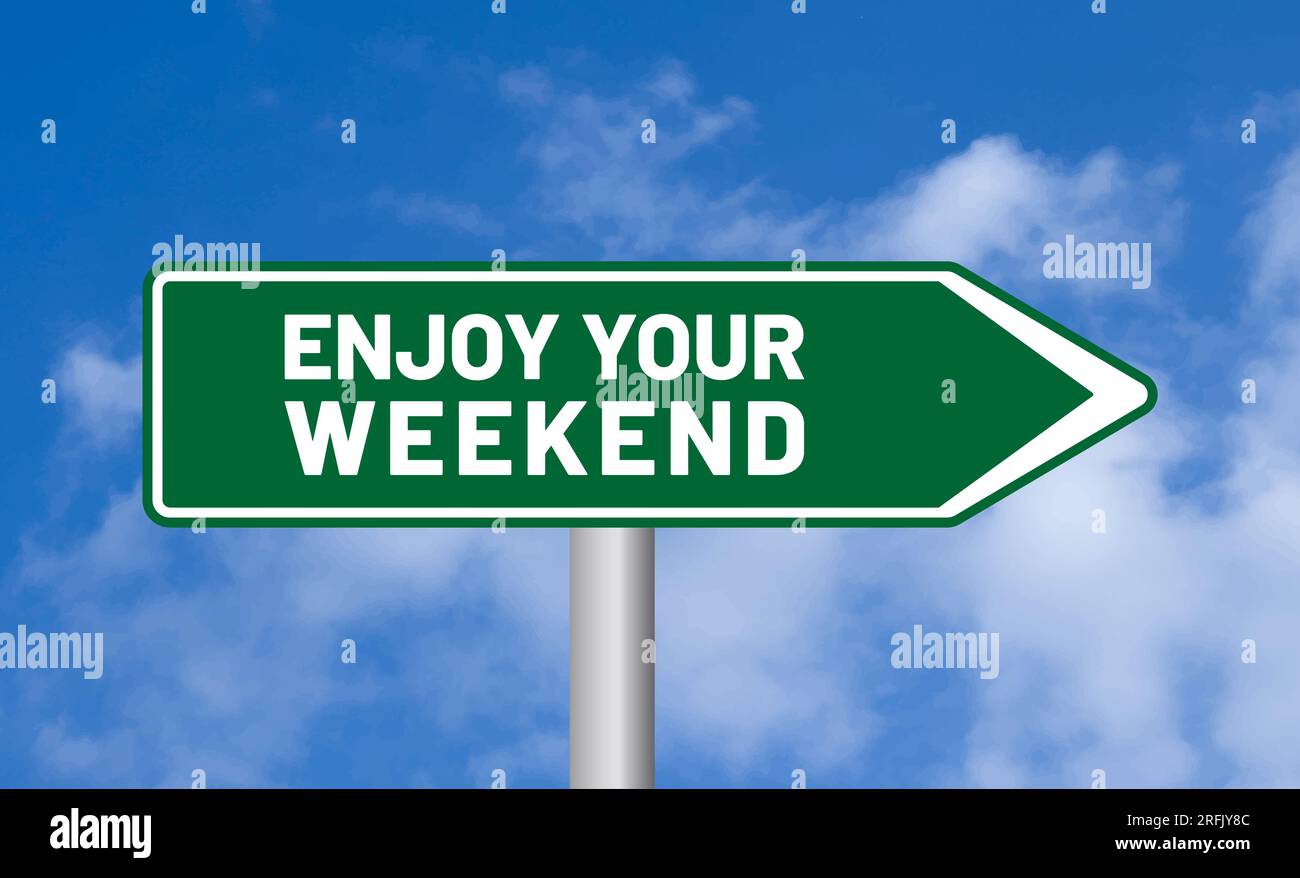 Enjoy your weekend road sign on cloudy sky background Stock Photo - Alamy