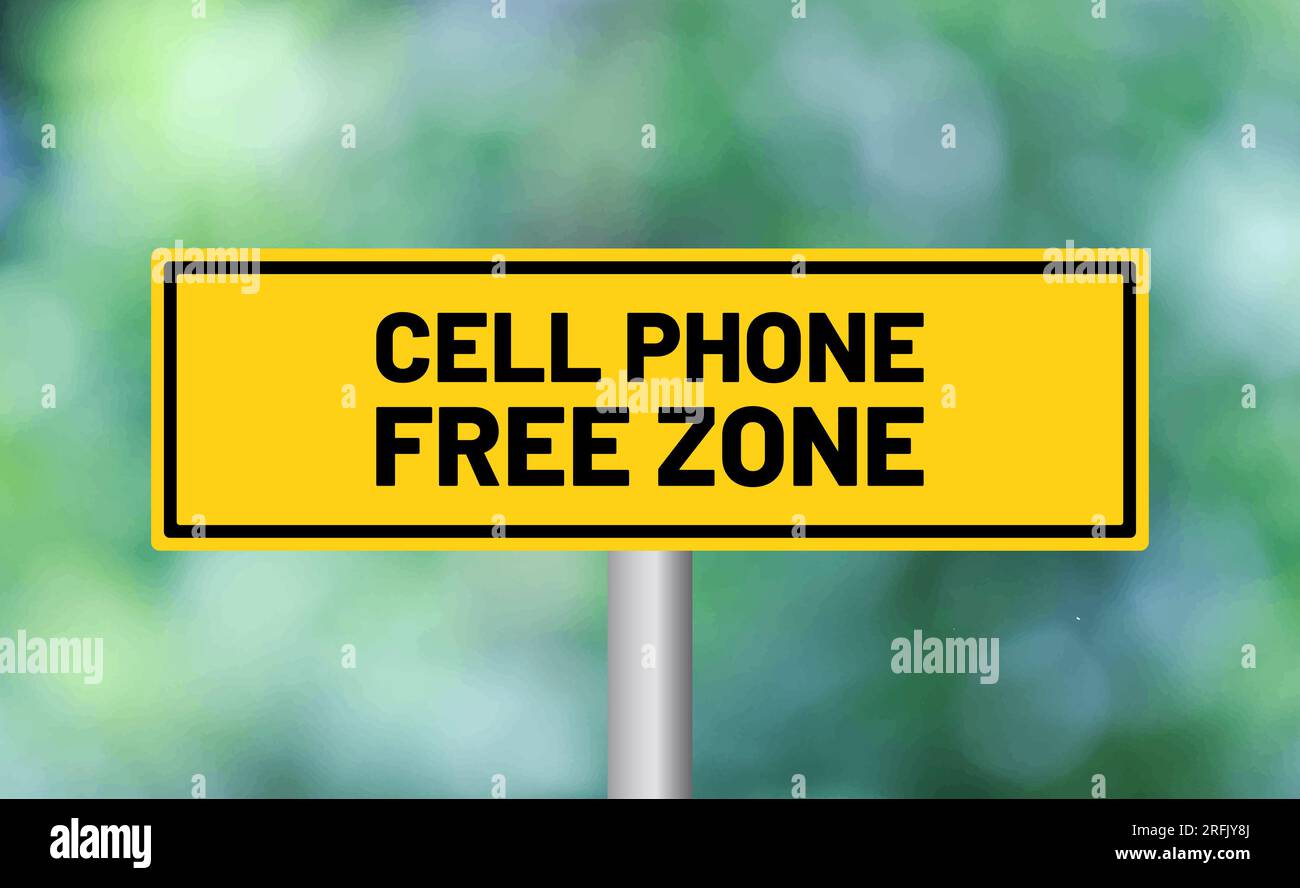 Cell phone free zone road sign on blur background Stock Photo - Alamy