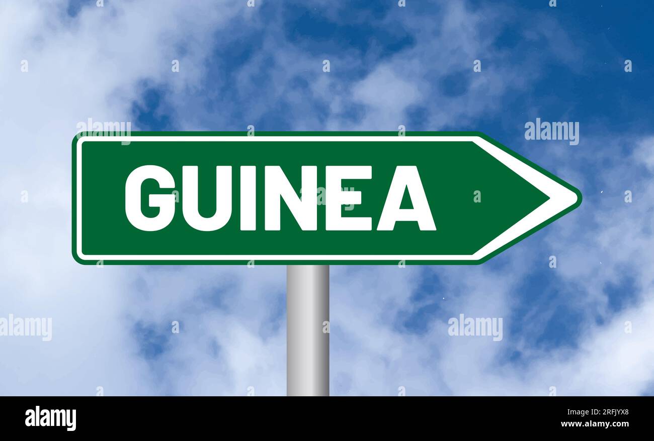 Guinea road sign on blue sky background Stock Photo - Alamy