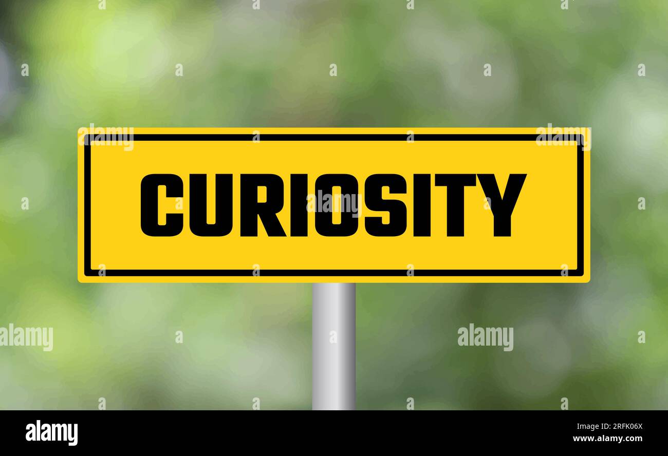 Curiosity road sign on blur background Stock Photo - Alamy