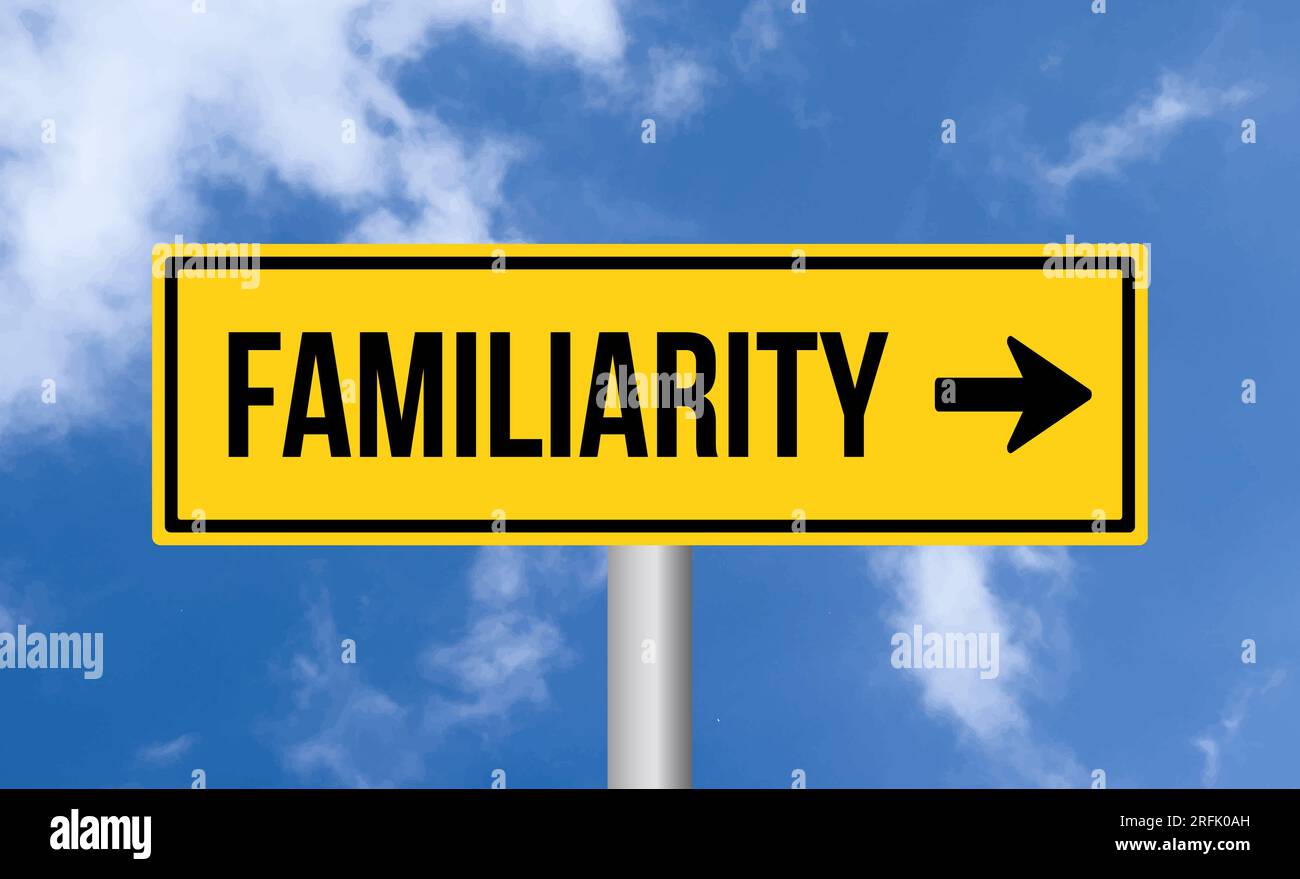 Familiarity road sign on blue sky background Stock Photo - Alamy
