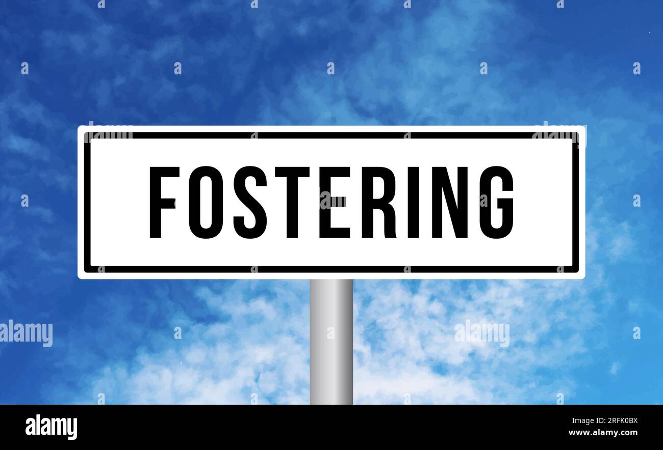 Fostering road sign on blue sky background Stock Photo - Alamy