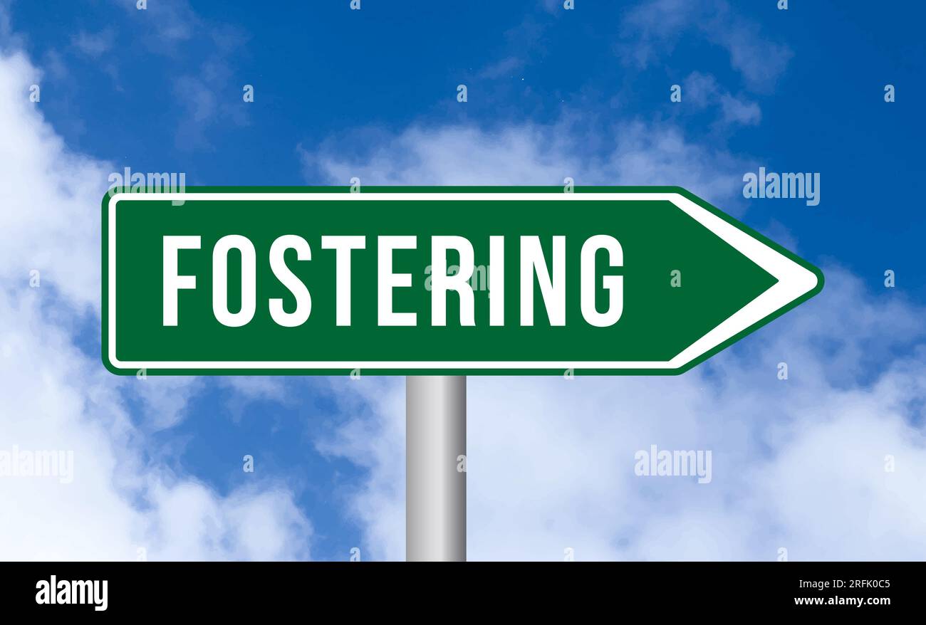 Fostering road sign on blue sky background Stock Photo - Alamy