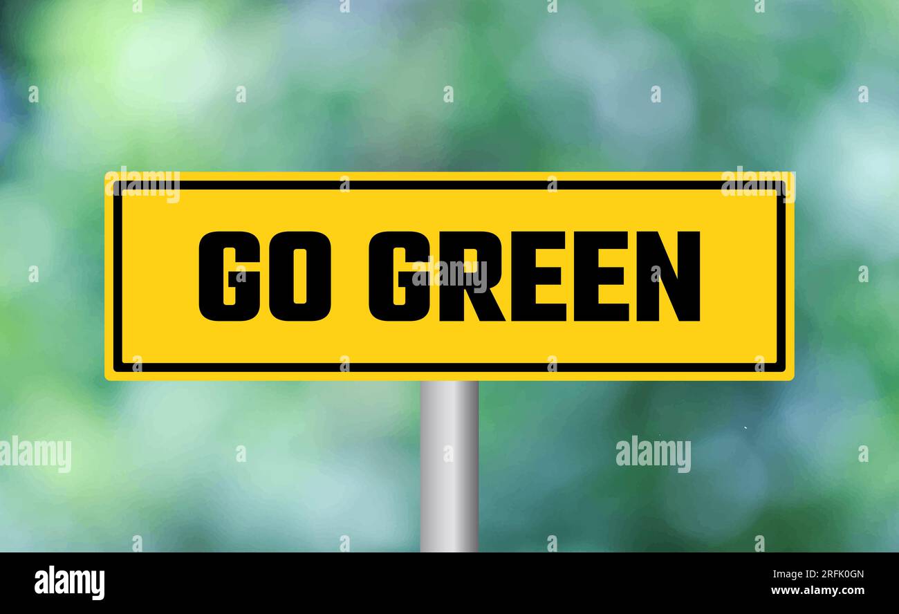 Go green road sign on blur background Stock Photo - Alamy