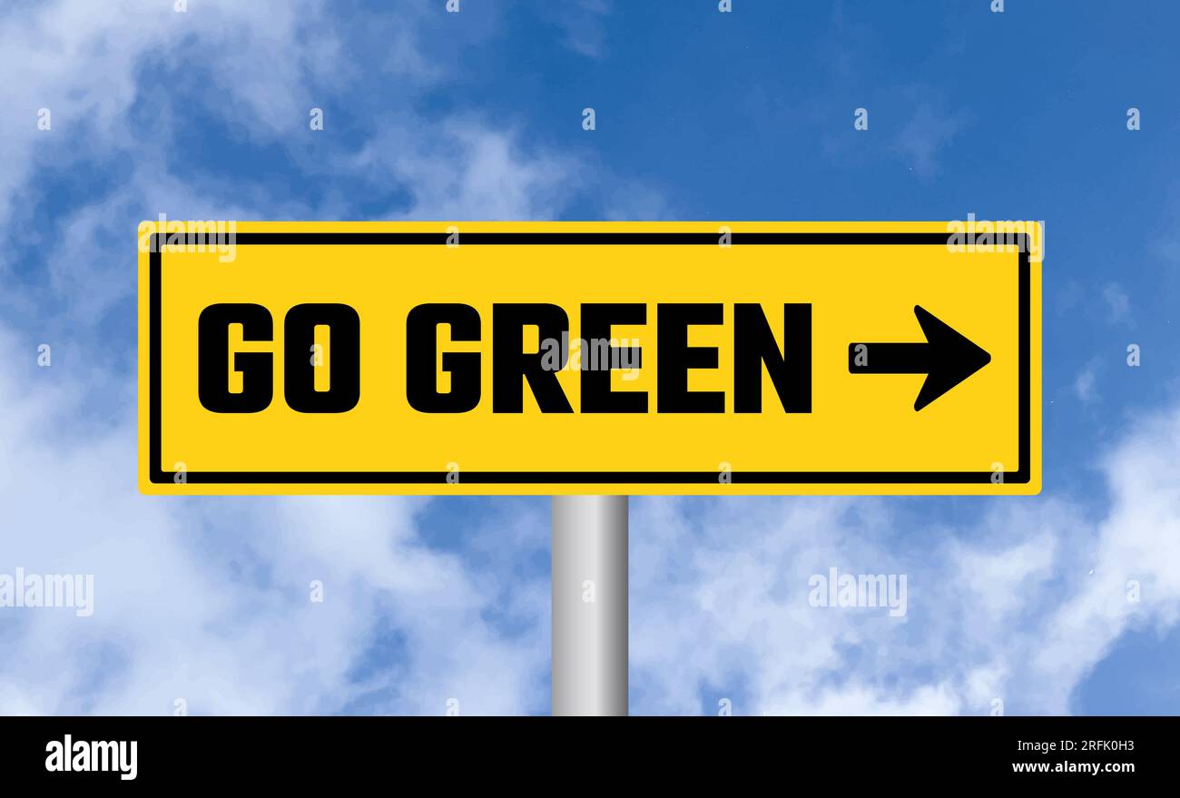 Go green road sign on blue sky background Stock Photo - Alamy