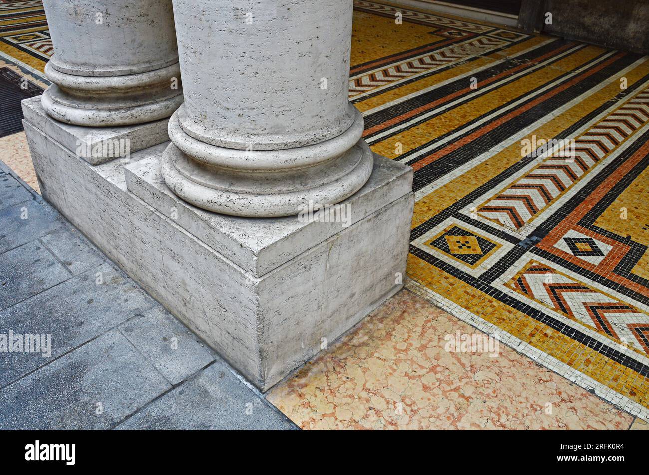 Bases of columns and mosaics in an outdoor gallery on Ugo Bassi Street ...