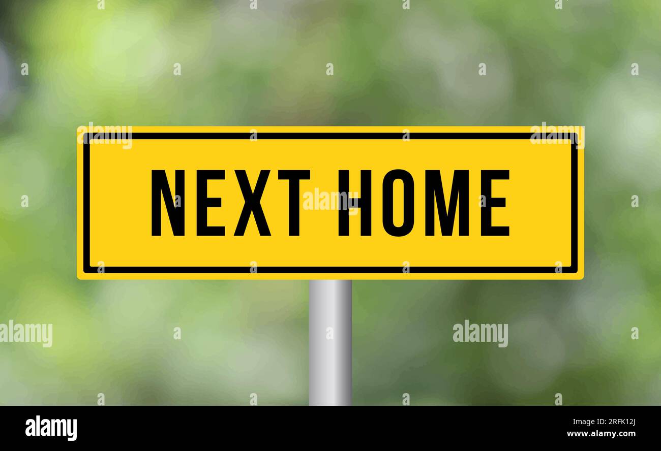 Next home road sign on blur background Stock Photo - Alamy