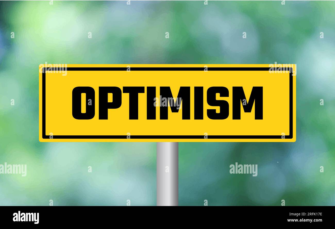 Optimism road sign on blur background Stock Photo - Alamy